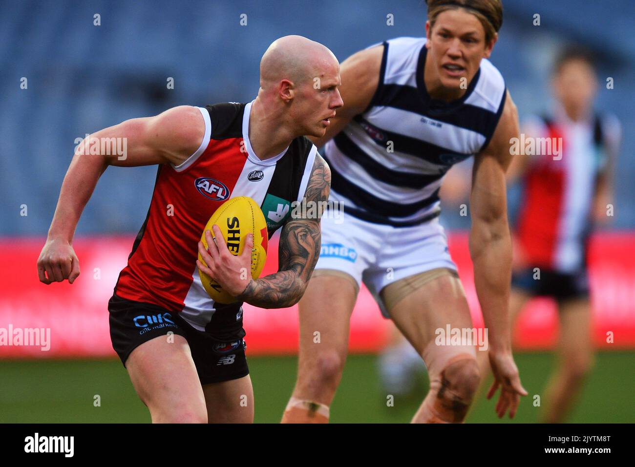 Zak Jones of St Kilda (left) in action during the AFL Round 22 match ...