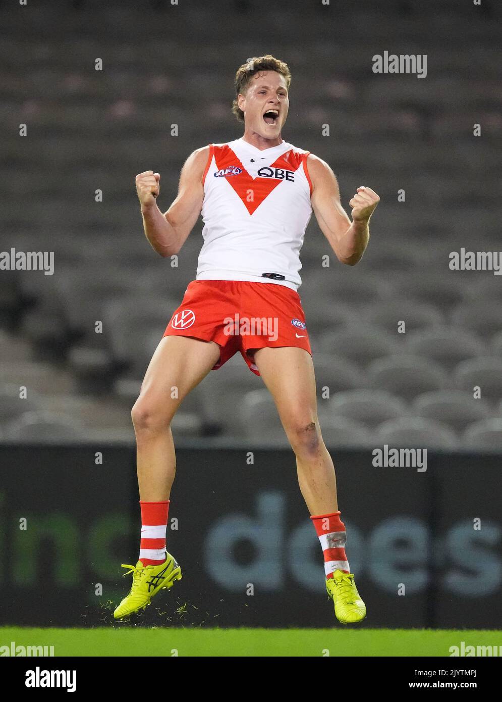 Hayden McLean of the Swans celebrates after kicking a goal during the ...