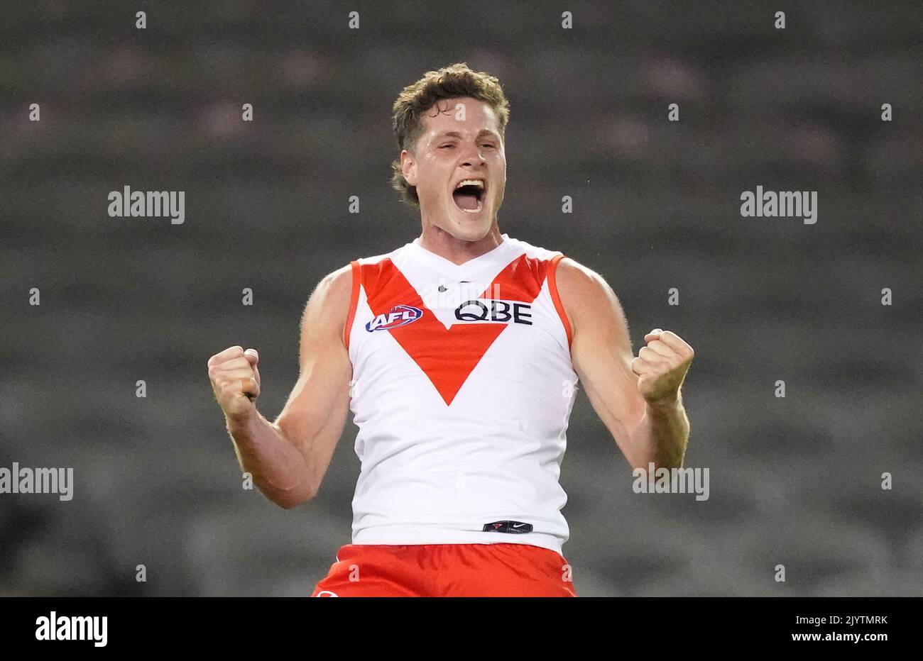 Hayden McLean of the Swans celebrates after kicking a goal during the ...