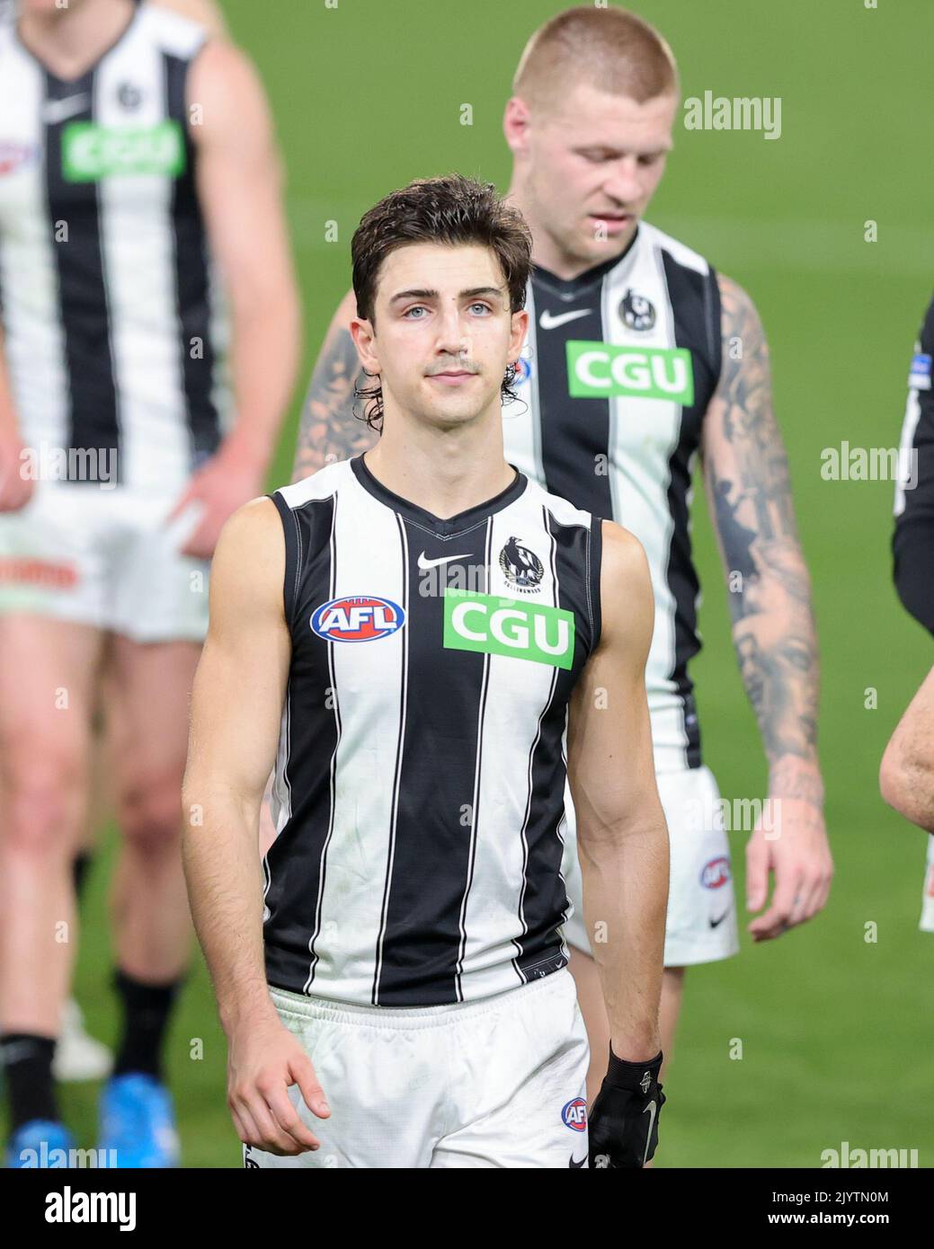 Josh Daicos of the Magpies leaves the field after the AFL Round 22 ...