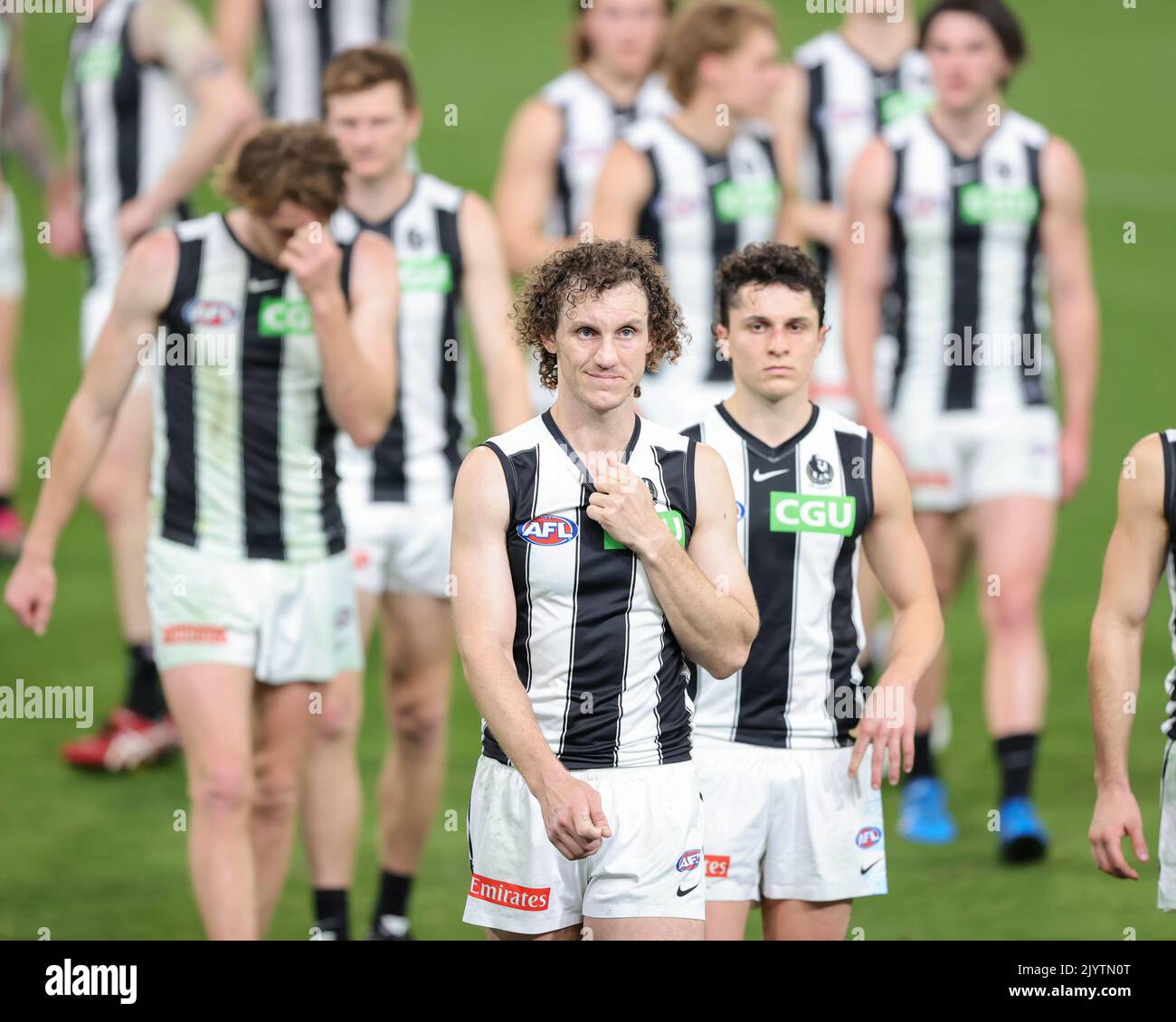 Chris Mayne of the Magpies leaves the field after the AFL Round 22 ...
