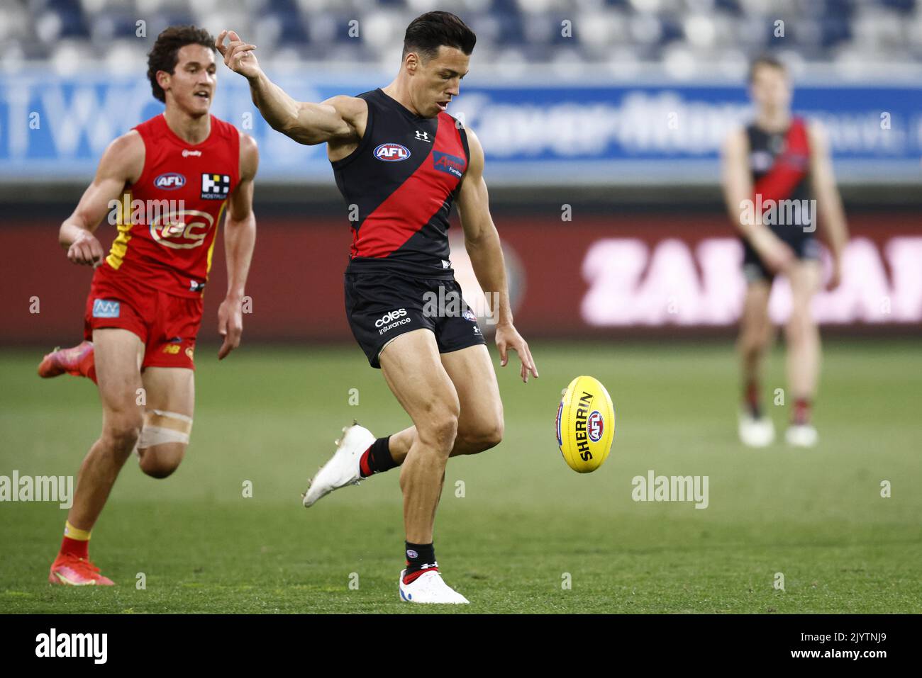 Dylan Shiel of the Bombers kicks the ball during the AFL Round 22 match ...