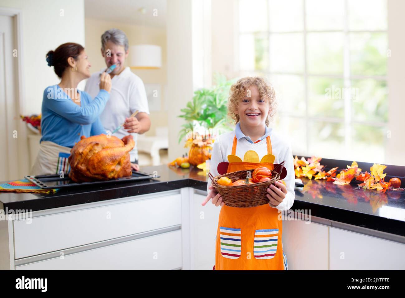 Turkey for Thanksgiving. Family cooking festive dinner. Mother, father ...