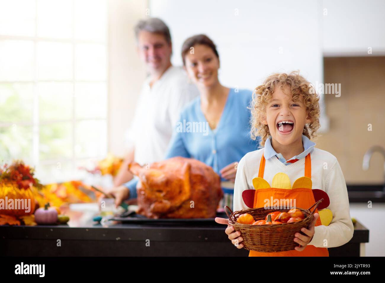 Turkey for Thanksgiving. Family cooking festive dinner. Mother, father ...