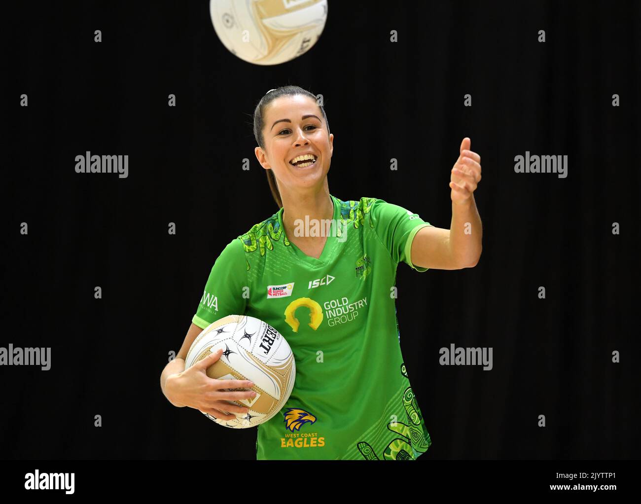 Emma Cosh of the Fever is seen warming up before the Super Netball ...