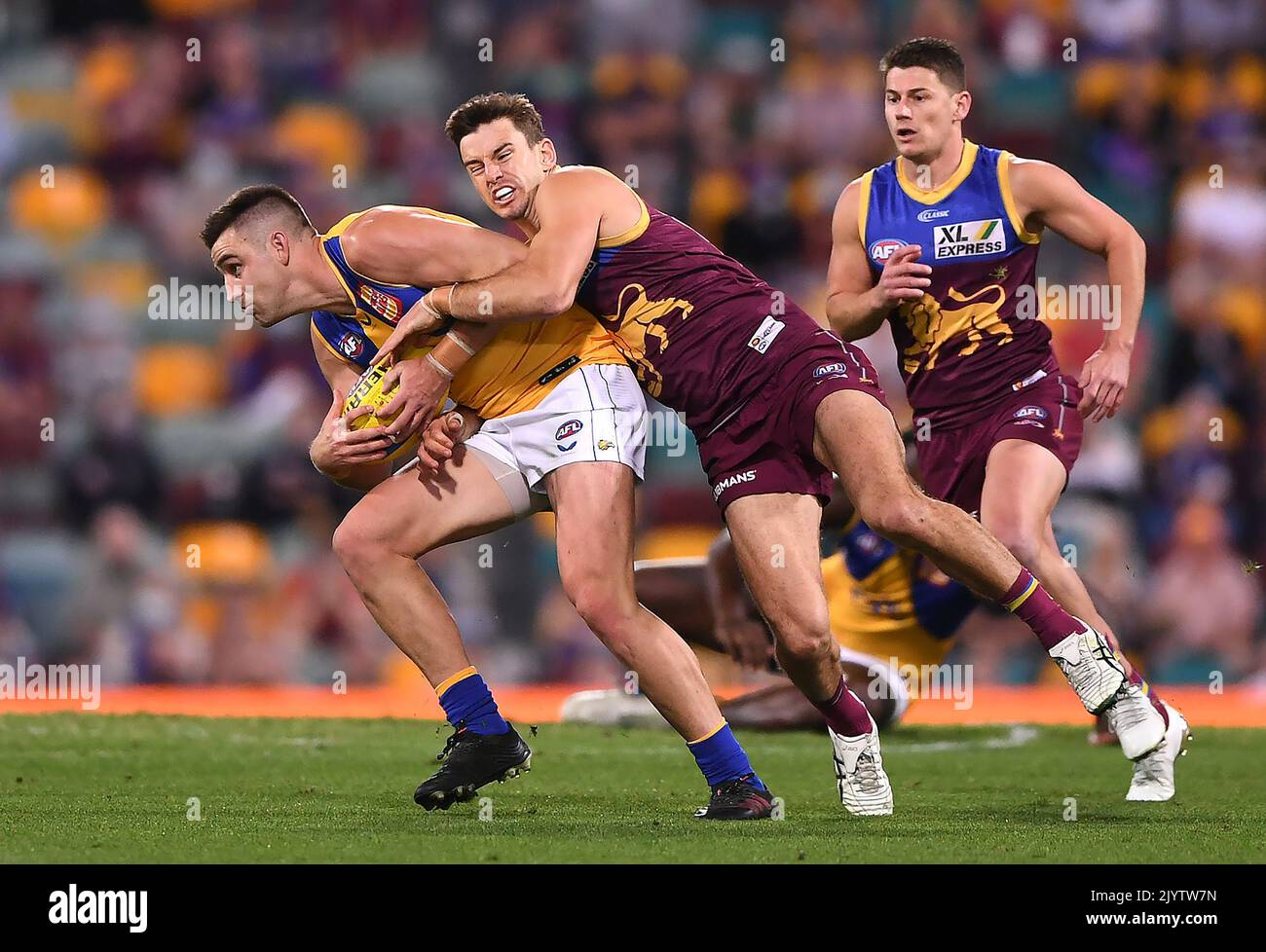 Jarryd Lyons of the Lions tackles Elliot Yeo of the Eagles during the ...