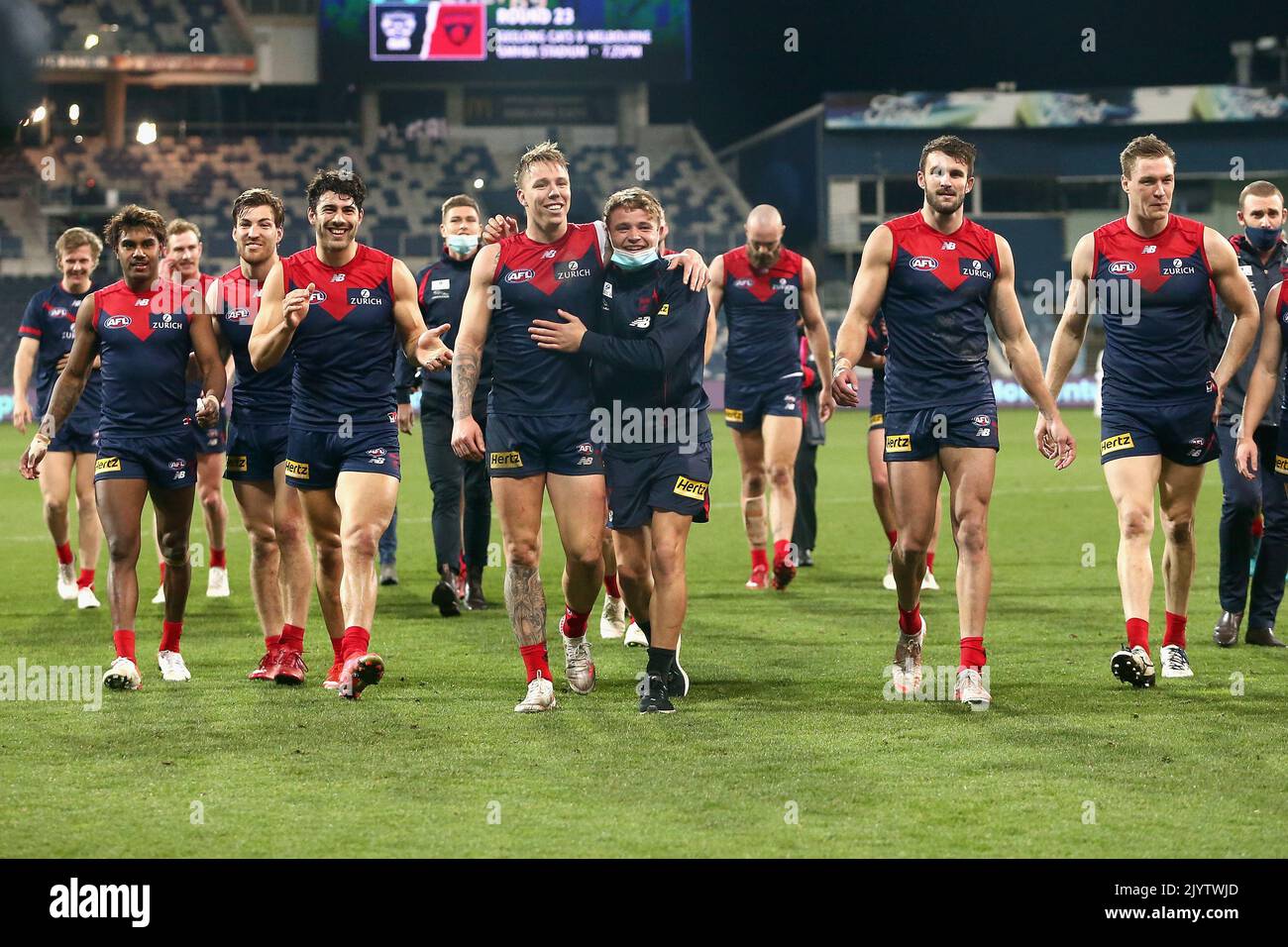 Demons players celebrate a win during the AFL Round 23 between the ...