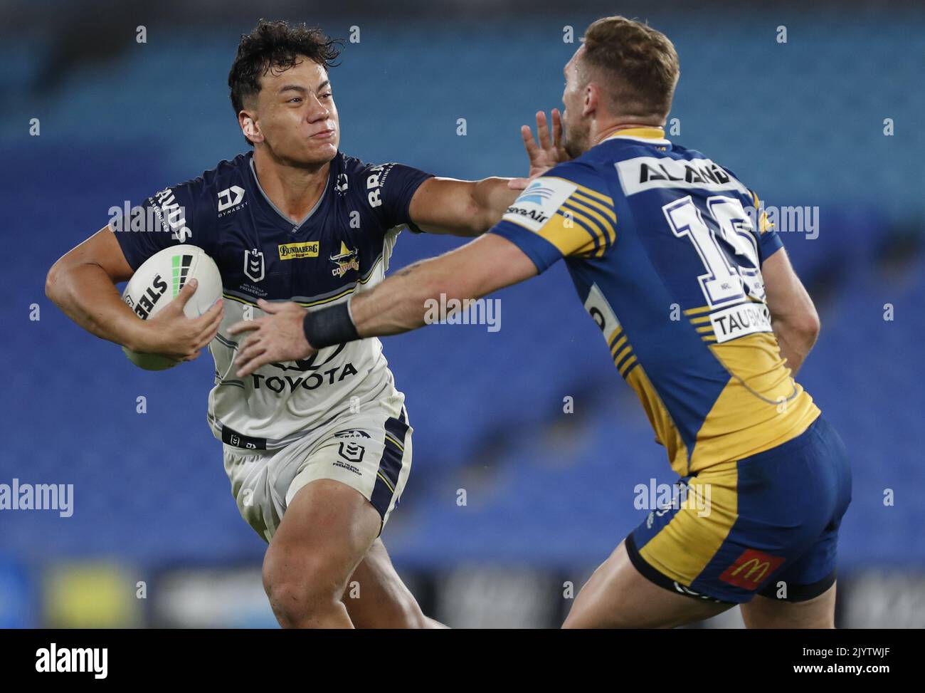 Daejarn Asi (left) of North Queensland Cowboys tries to get past by ...