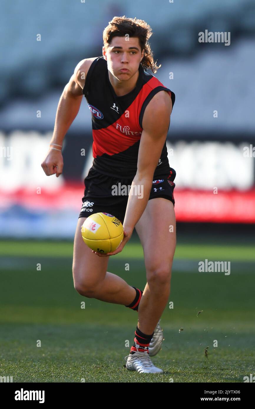 Sam Durham of Essendon handballs the footy during the Round 23 AFL ...