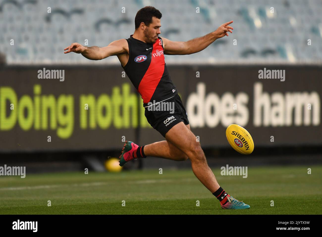 Alec Waterman of Essendon Bombers kicks the footy during the Round 23 ...
