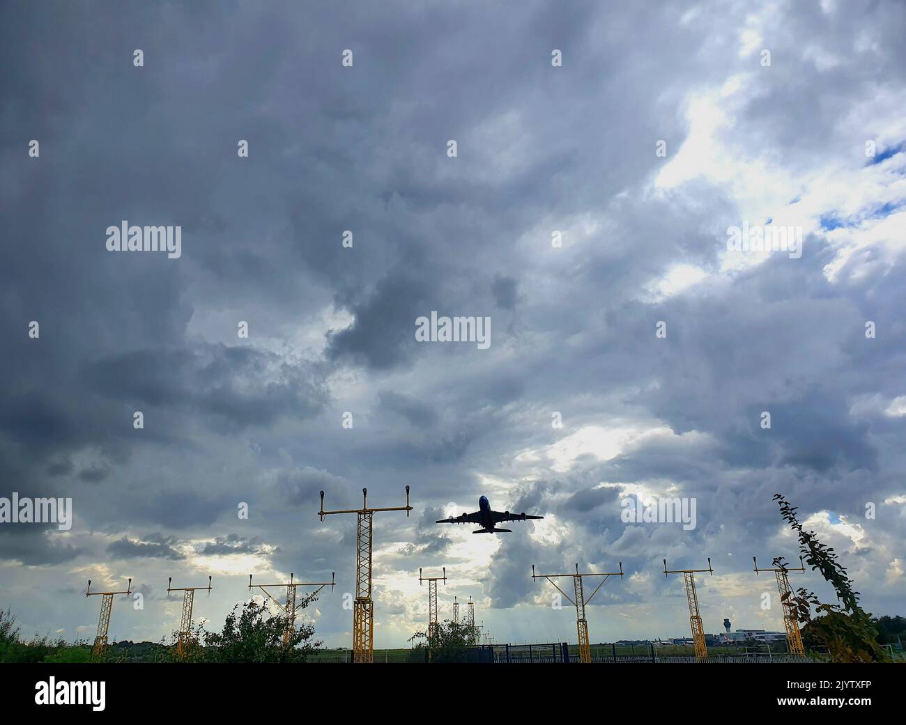 Passenger jet taking off at manchester airport Stock Photo - Alamy
