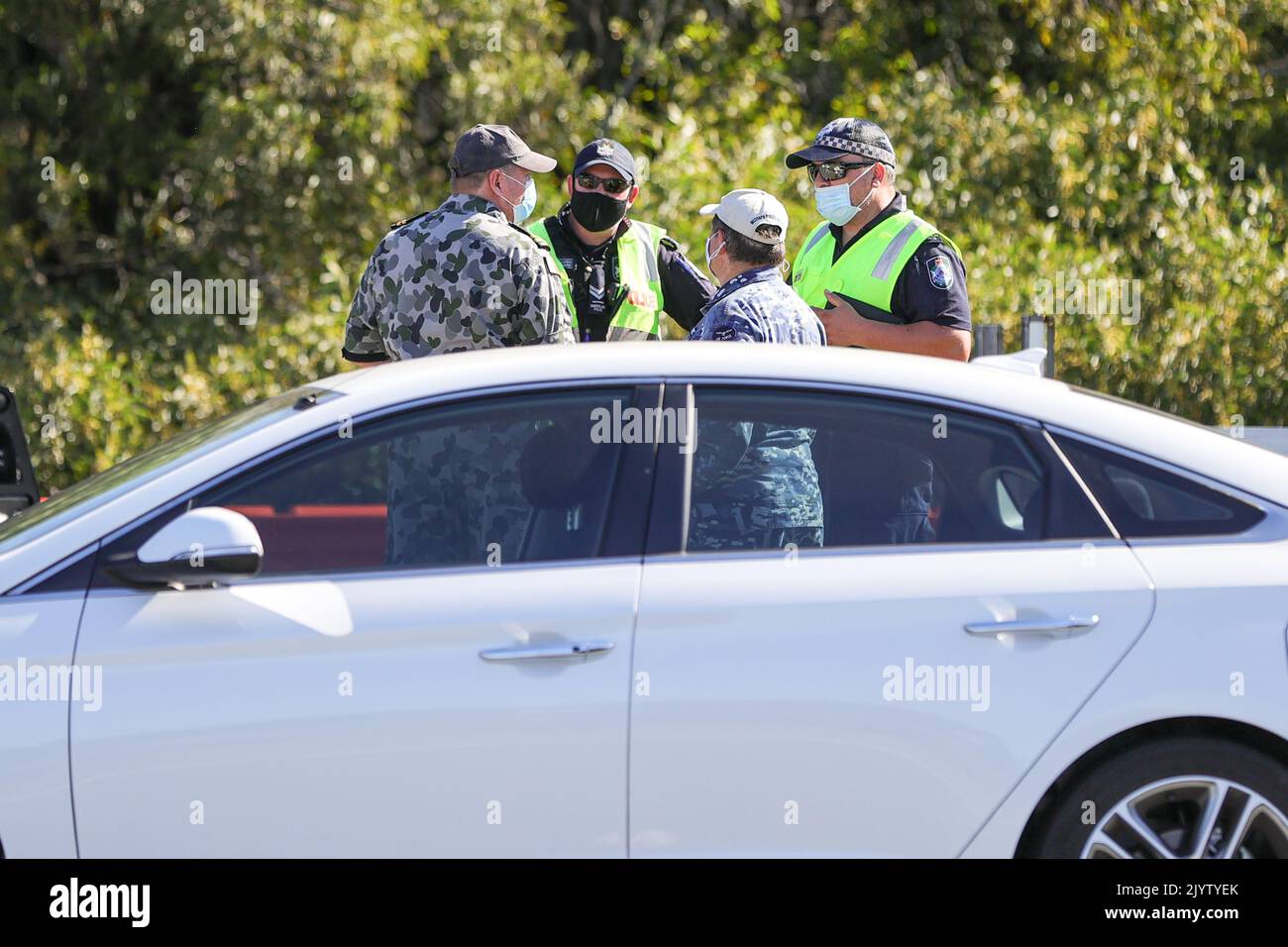 Australian Defence Force (ADF) personnel and Queensland Police process ...