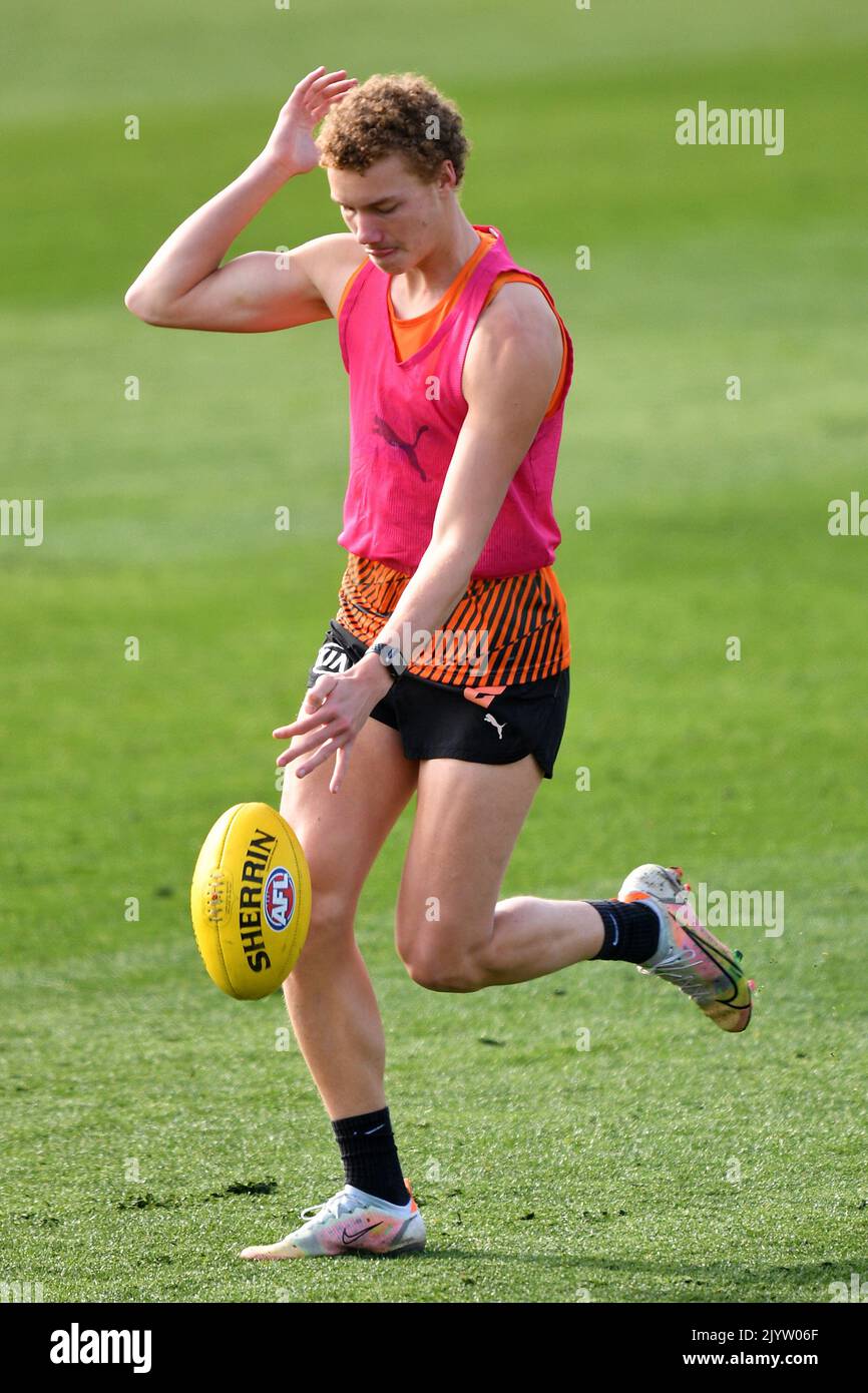 Ryan Angwin of the Giants kicks the footy during a GWS Giants AFL ...