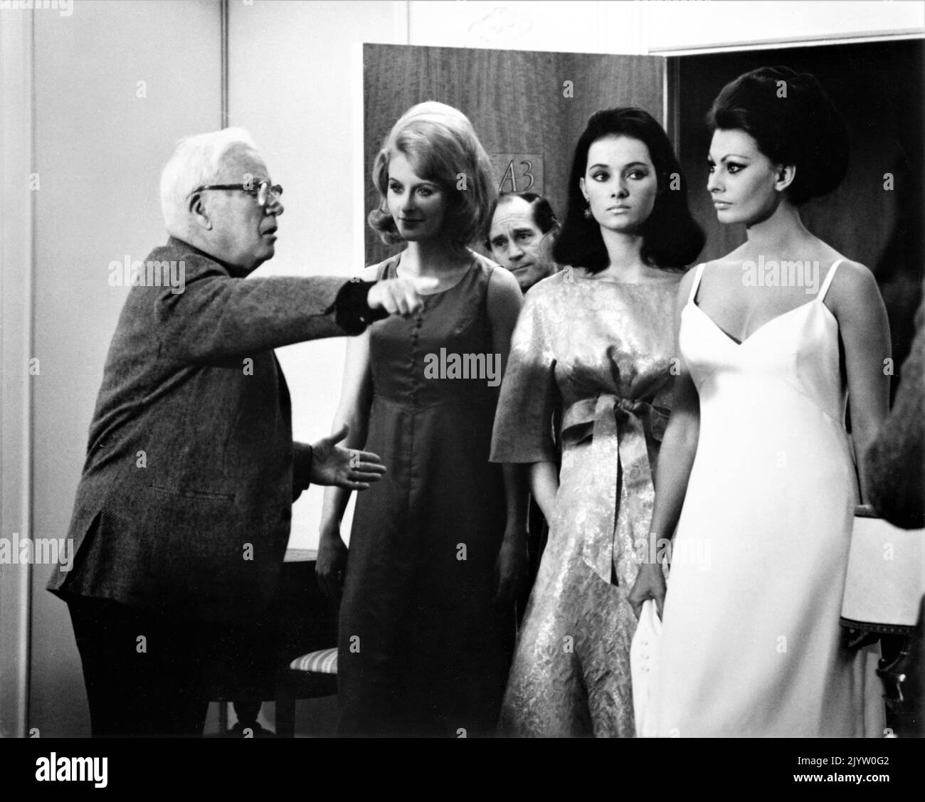 CHARLIE CHAPLIN directing two Extra Girls and SOPHIA LOREN on set ...