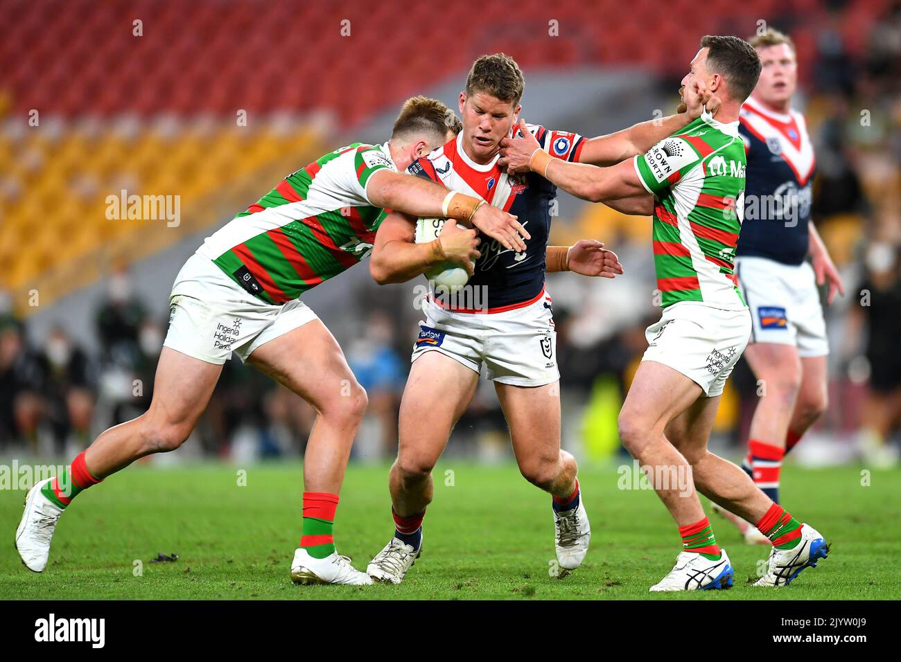 Egan Butcher of the Roosters is tackled during the Round 24 NRL match ...