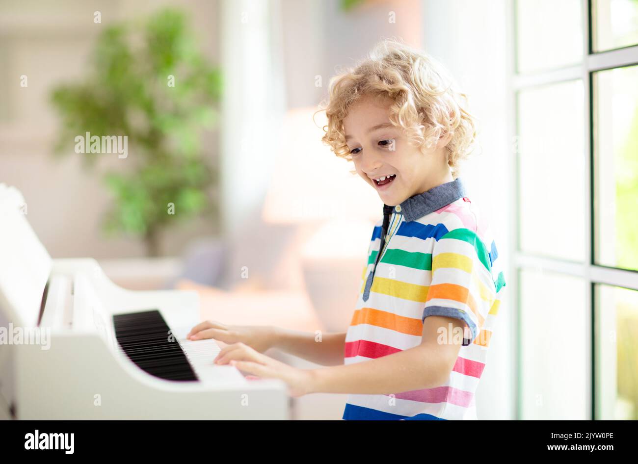 Child playing piano. Kids play music. Classical education for children ...
