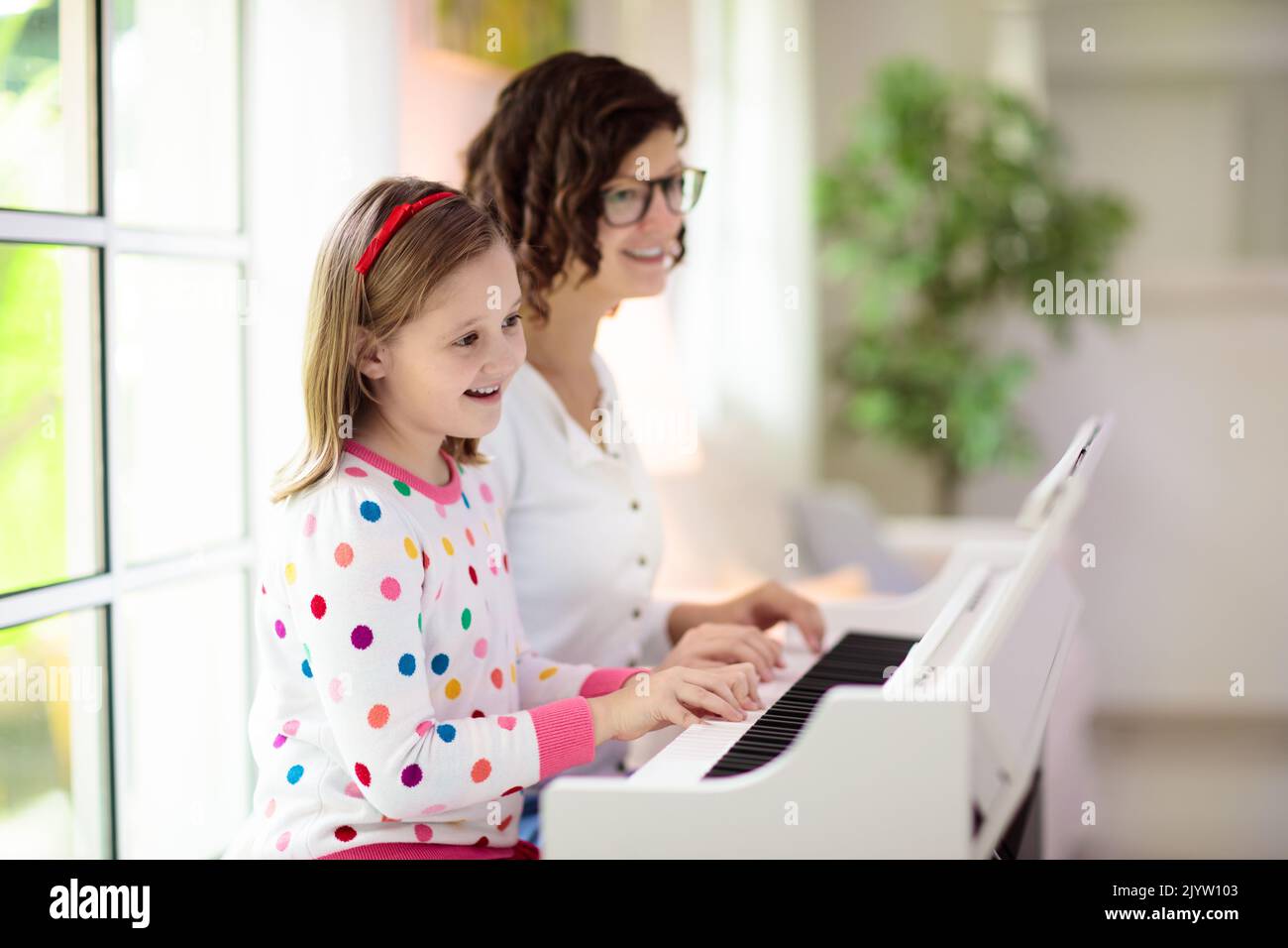 Child playing piano. Kids play music. Classical education for children ...