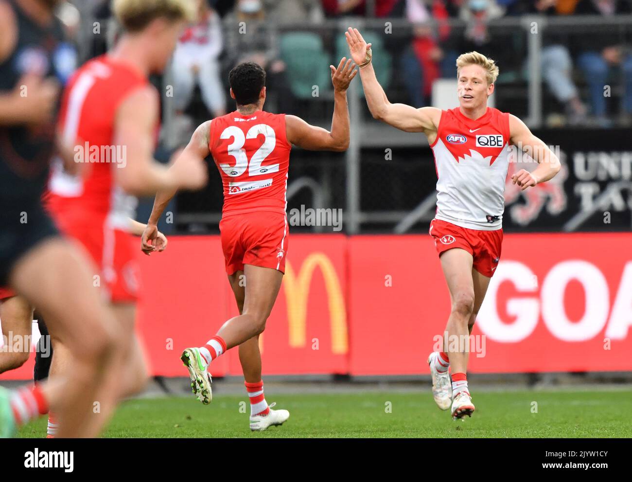 Isaac Heeney (right) of the Swans celebrates kicking a goal with James ...