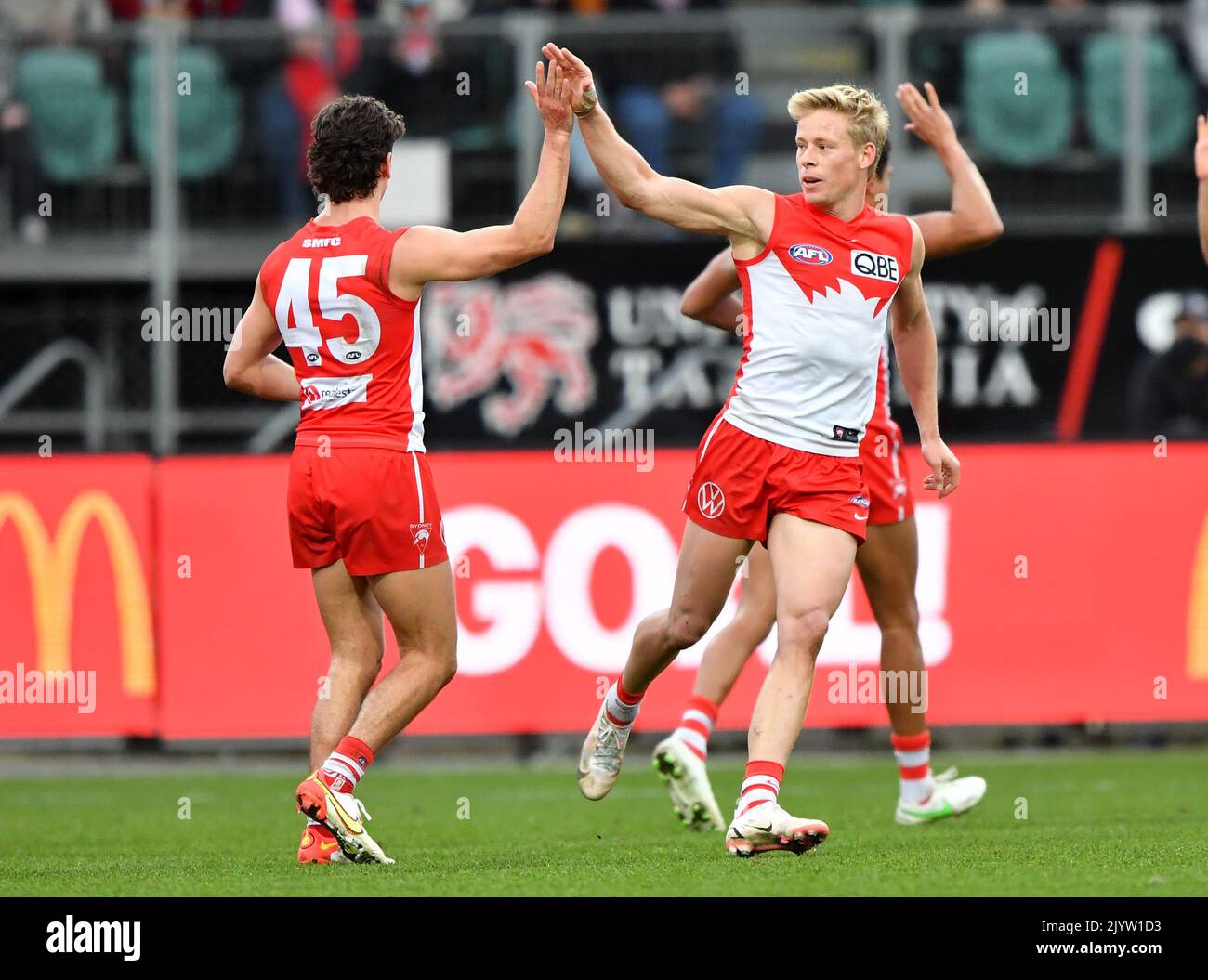 Isaac Heeney (right) of the Swans celebrates kicking a goal with Sam ...