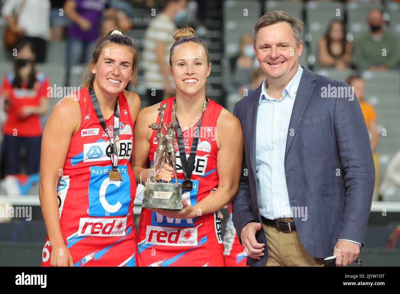 Swifts Maddy Proud and Paige Hadley with Suncorp CEO Steve Johnston ...
