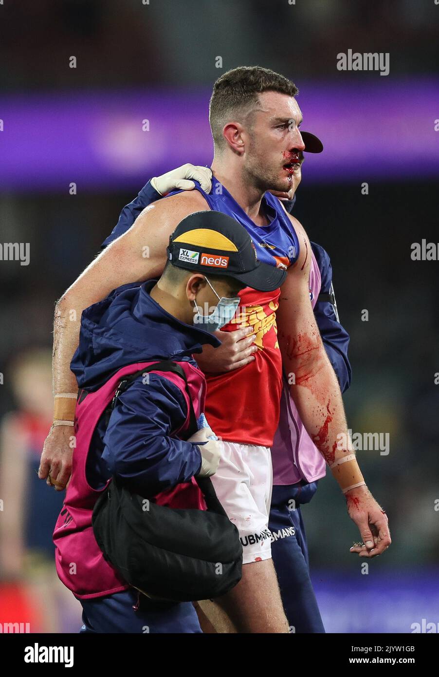 Daniel McStay of the Lions leaves the field injured during the AFL ...