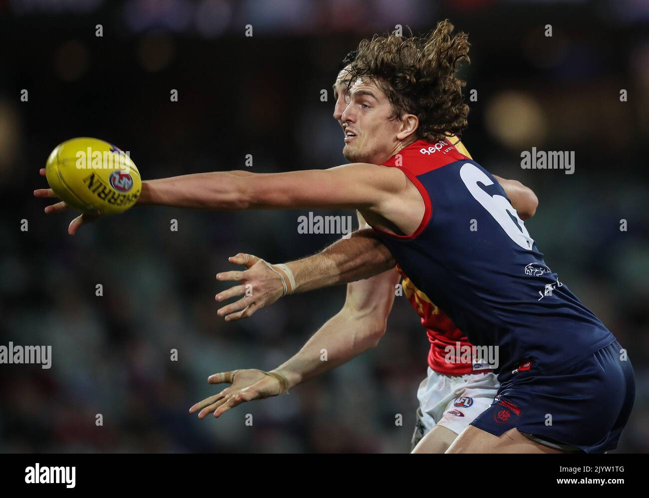 Oscar McInerney of the Lions and Luke Jackson of the Demons compete in ...