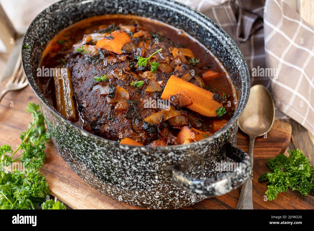 Meatloaf with brown sauce and vegetables. Traditional german "Falscher ...