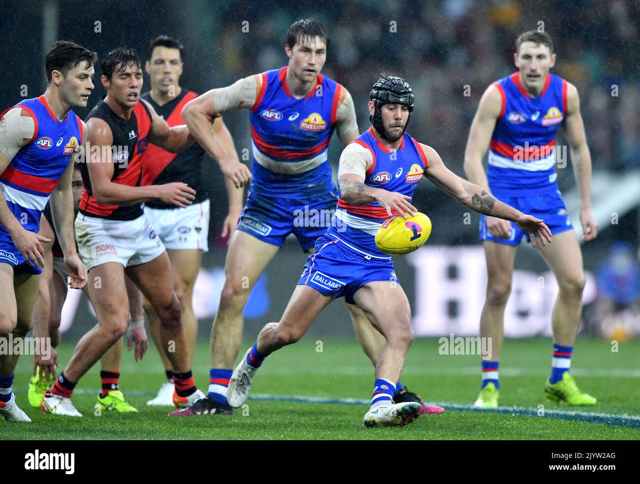 Caleb Daniel (2nd from right) of the Bulldogs in action during the AFL Elimination Final between ...