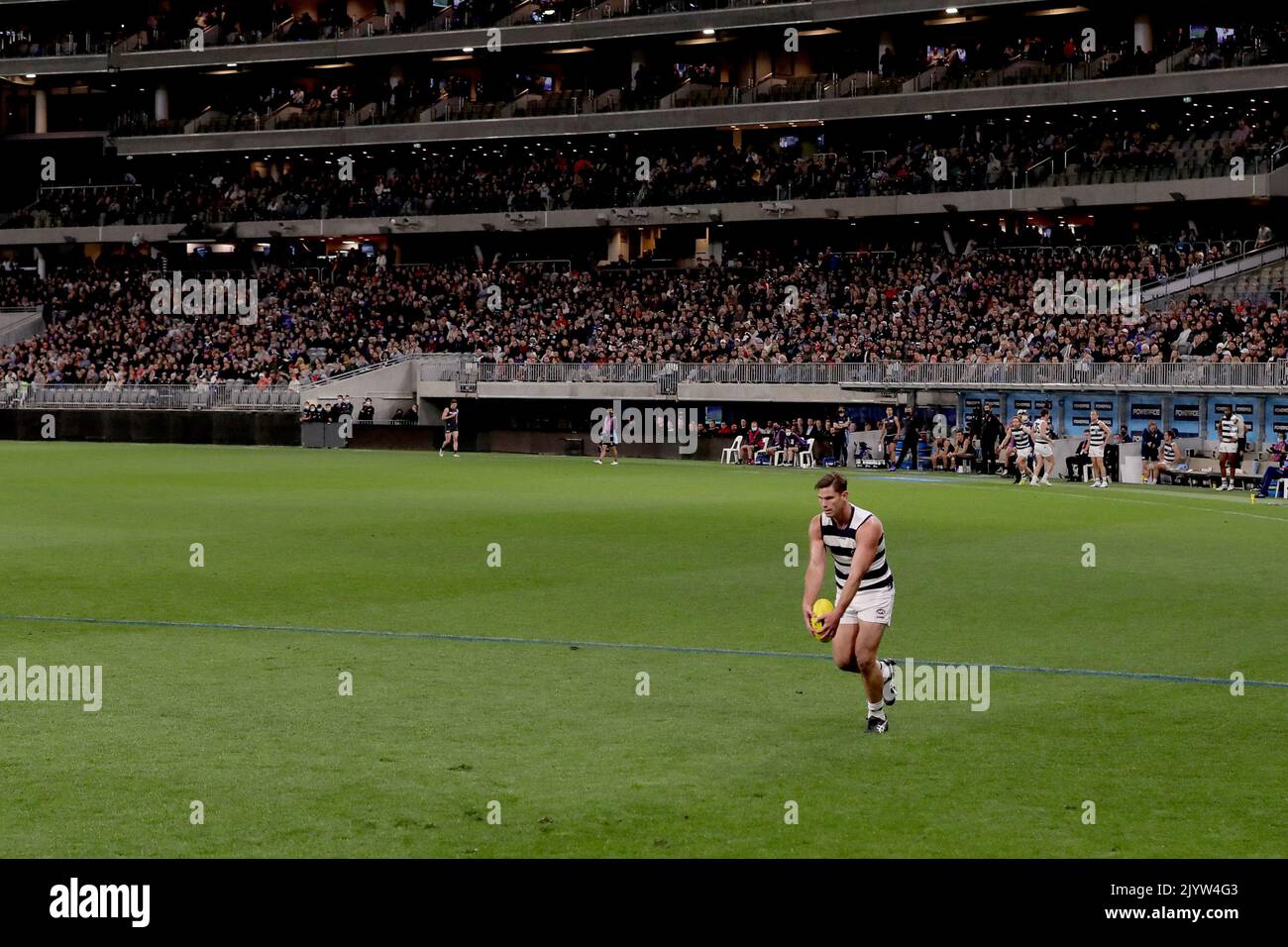 Tom Hawkins of the Cats kicks on goal during the second Semi-Final AFL ...