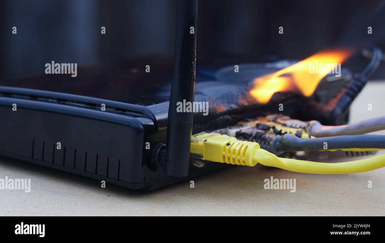 Burning Internet cable due to high congestion Stock Photo - Alamy