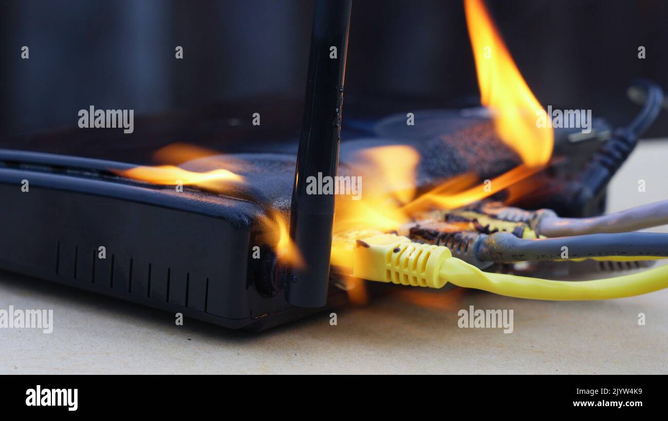 Burning Internet cable due to high congestion Stock Photo - Alamy