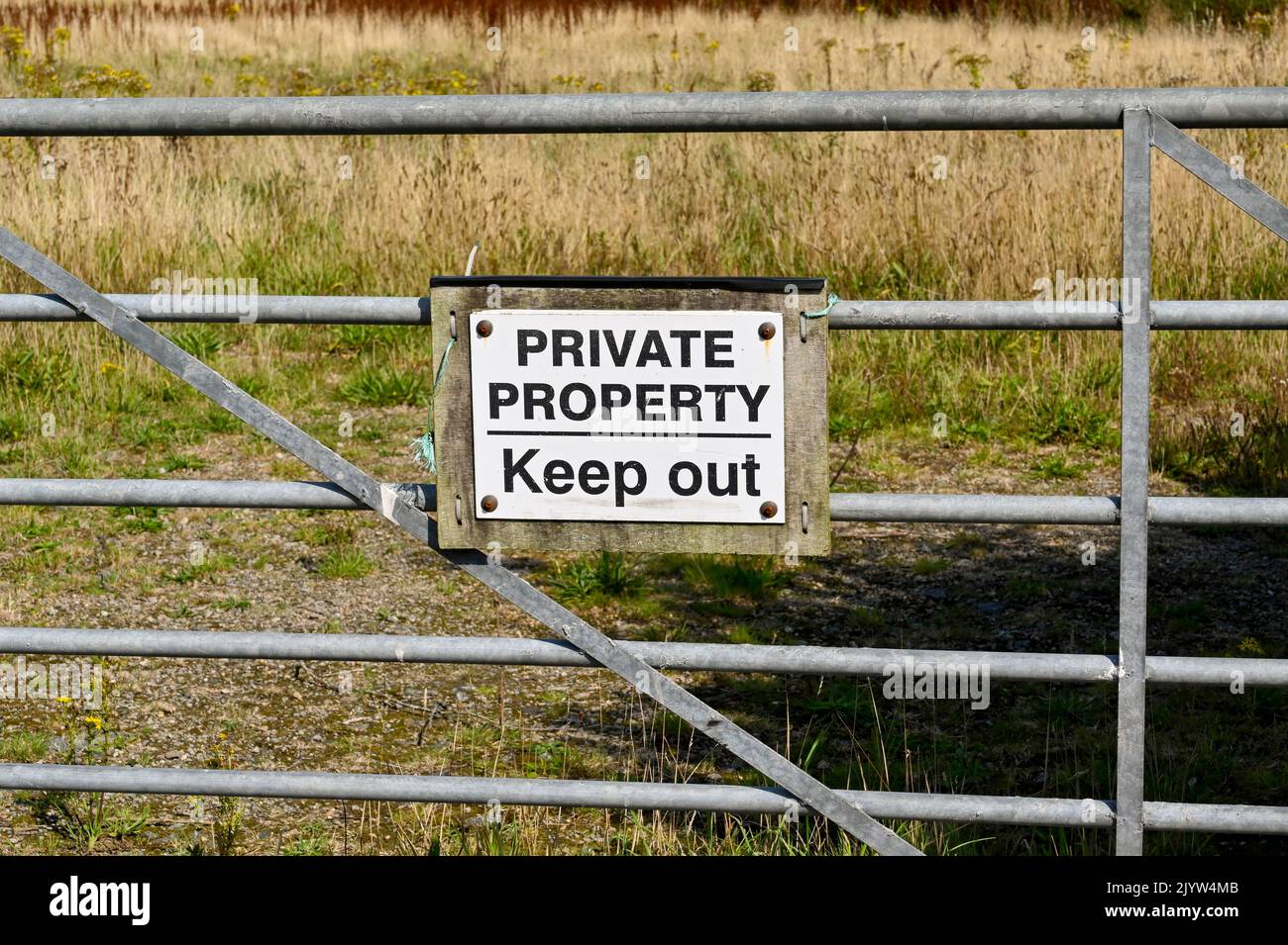 Private Property sign on a farm gate. No people Stock Photo - Alamy