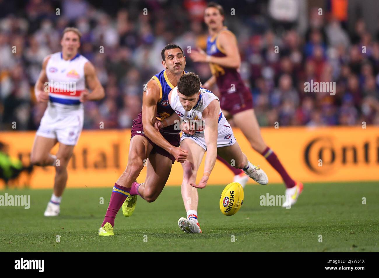 Nakia Cockatoo of the Lions competes with Taylor Duryea of the Bulldogs ...
