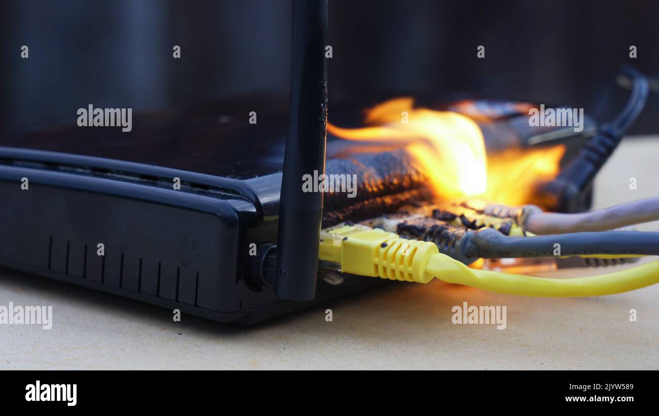 Burning Internet cable due to high congestion Stock Photo - Alamy
