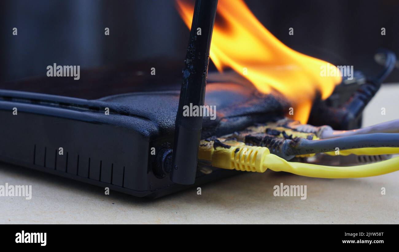 Burning Internet cable due to high congestion Stock Photo - Alamy