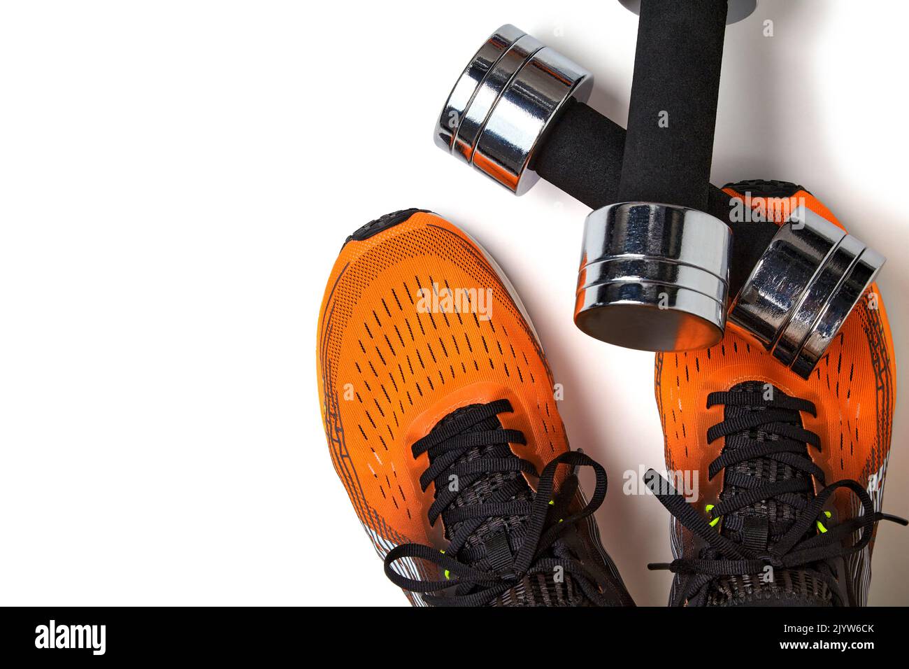 Fitness classes and foot injury in the gym. A metal heavy dumbbell fell ...