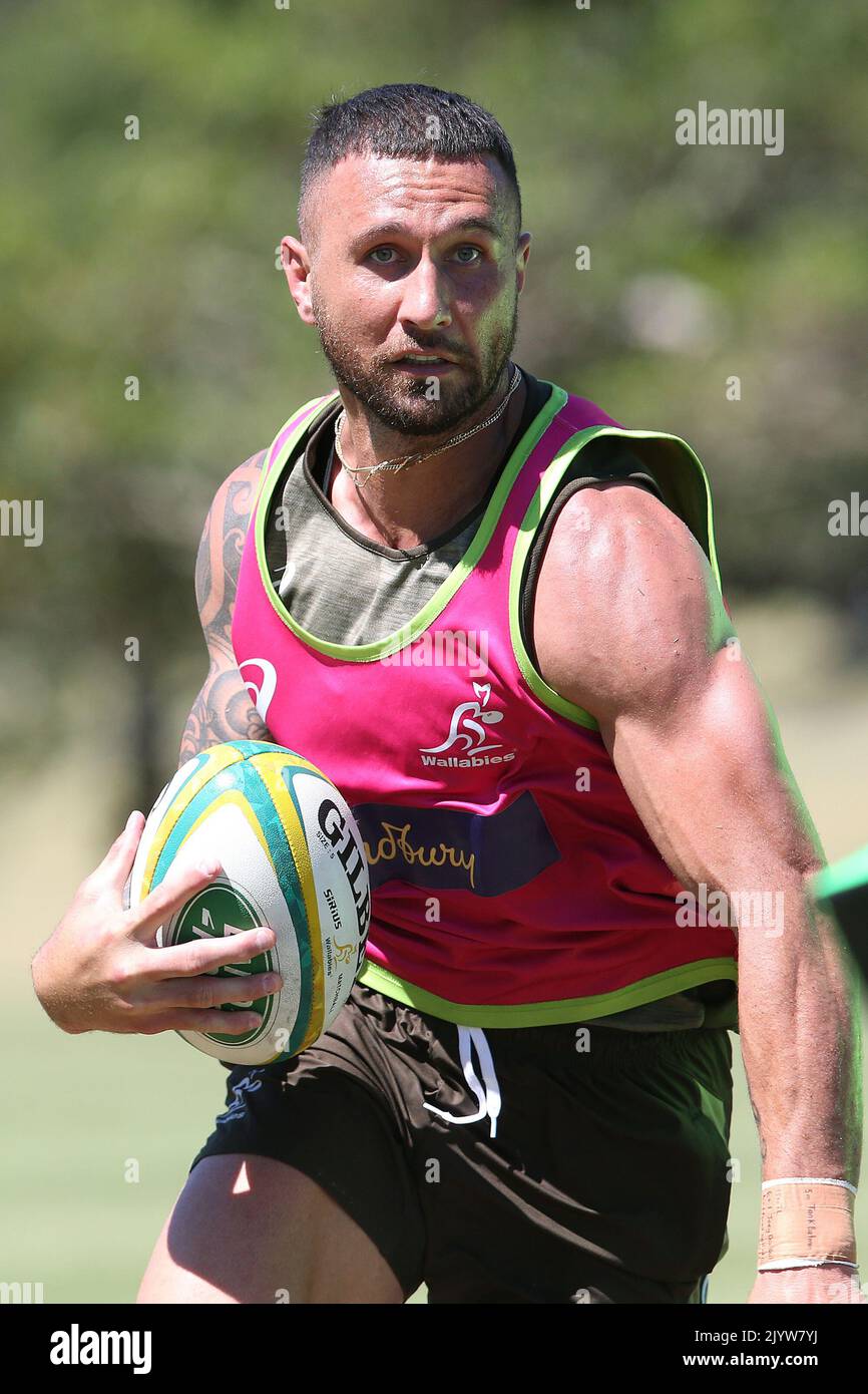Quade Cooper of the Wallabies runs with the ball during an Australian ...