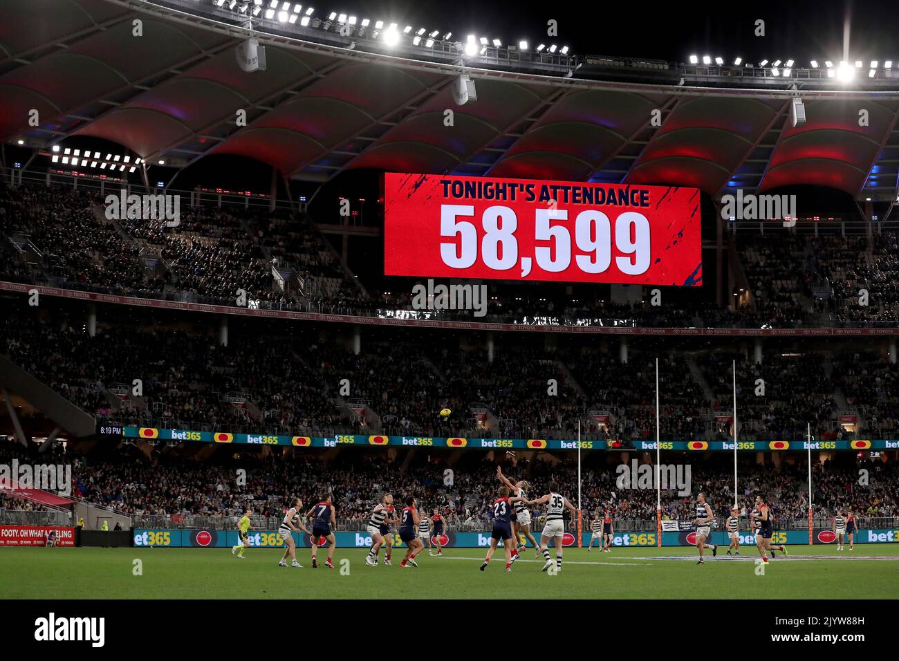 A crowd attendance of 58,599 people is displayed during the AFL ...