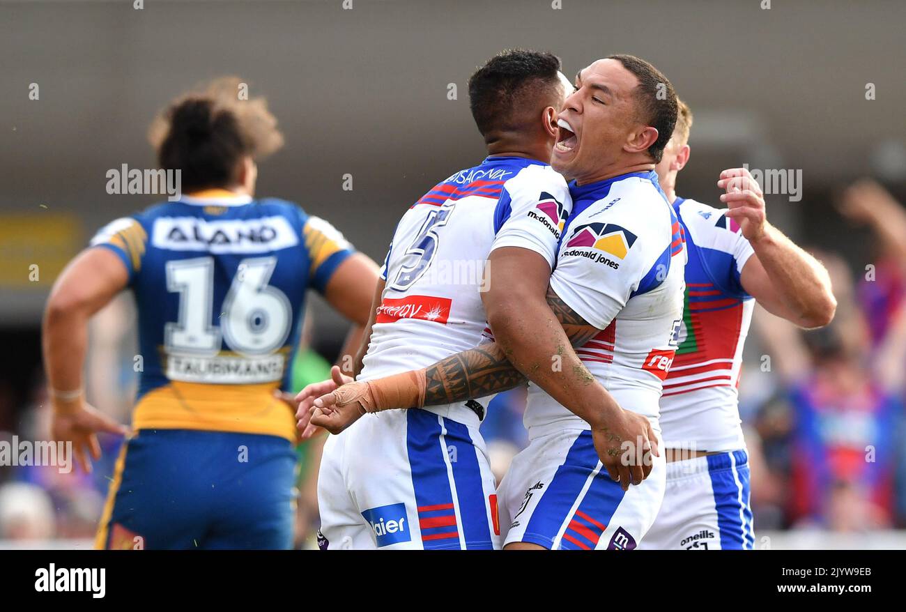 Hymel Hunt (left) of the Knights celebrates scoring a try with team ...