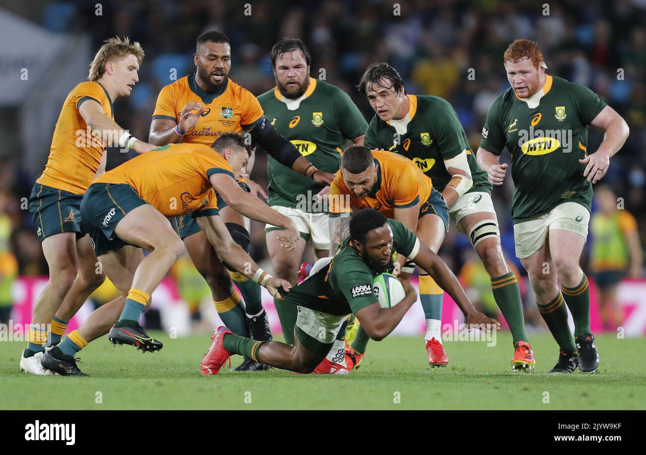 Tom Banks and Quade Cooper of Australia Wallabies tackles Lukhanyo Am ...