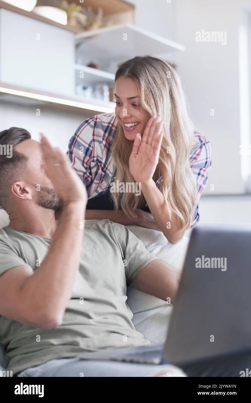 happy couple giving each other a high five Stock Photo - Alamy