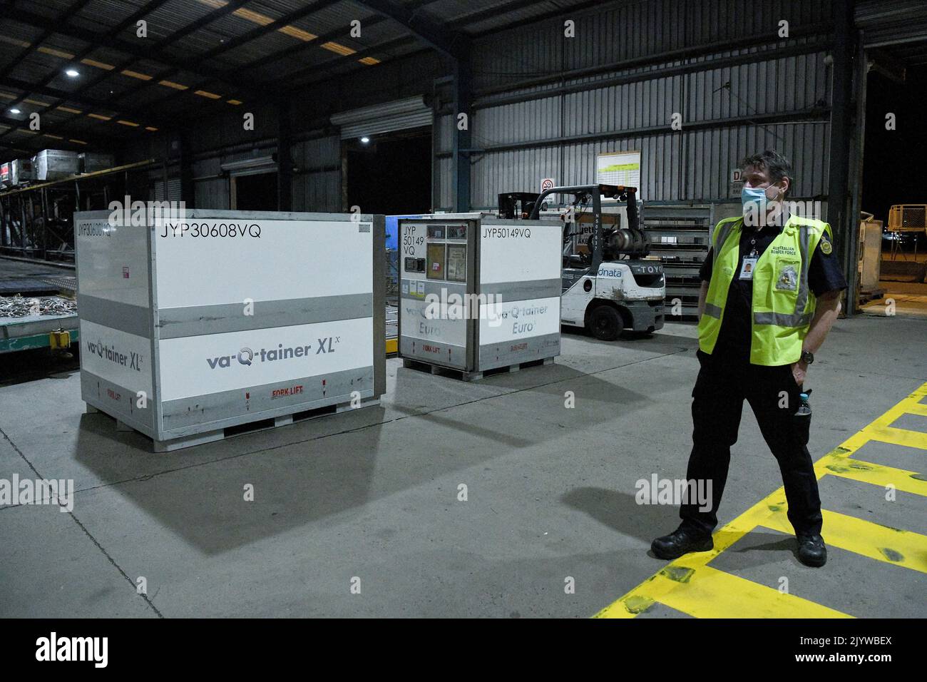Australian Border Force (ABF) officials watch over containers carrying ...