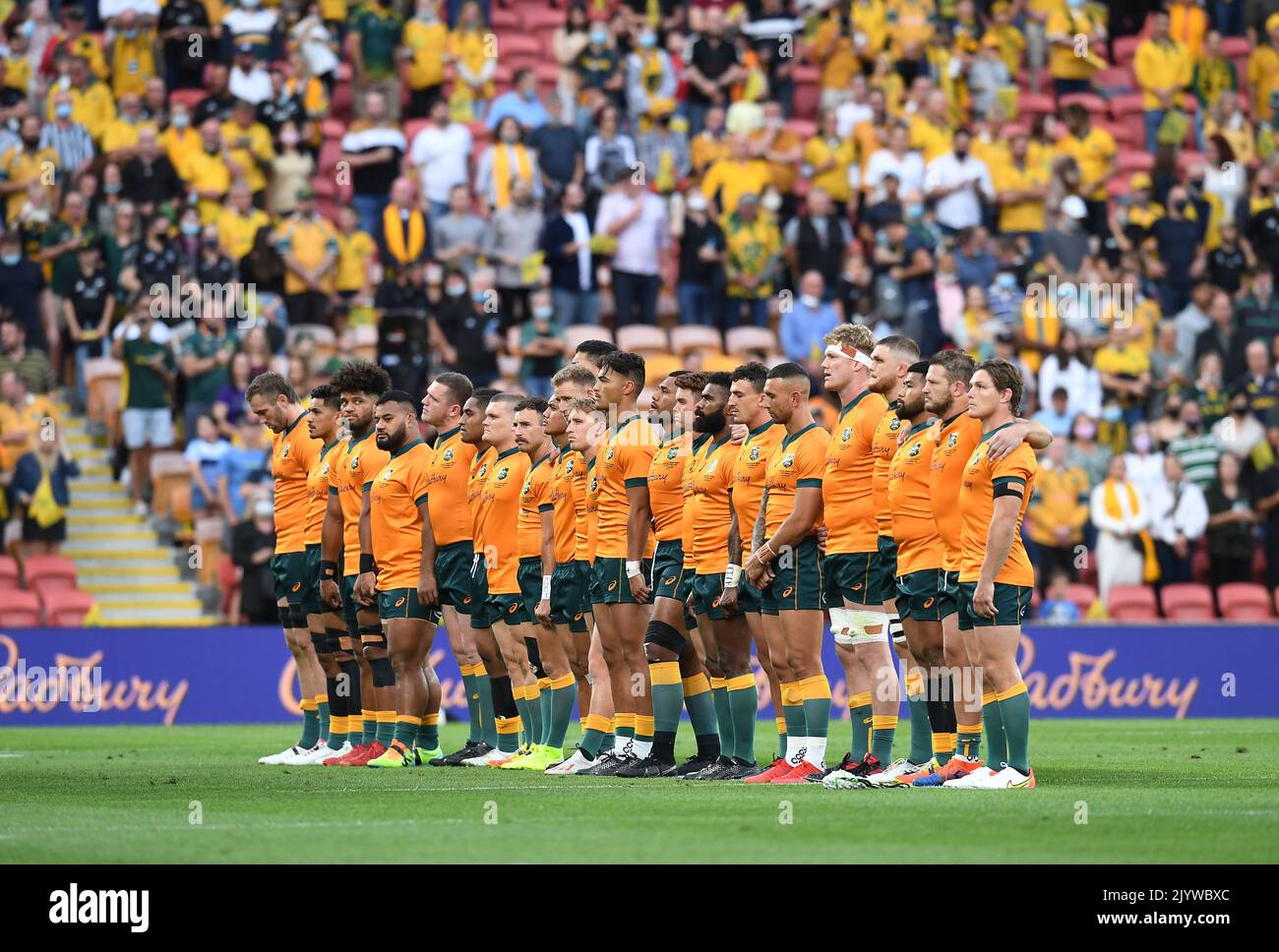 Wallabies players stand during the national anthem during the Round 4 ...