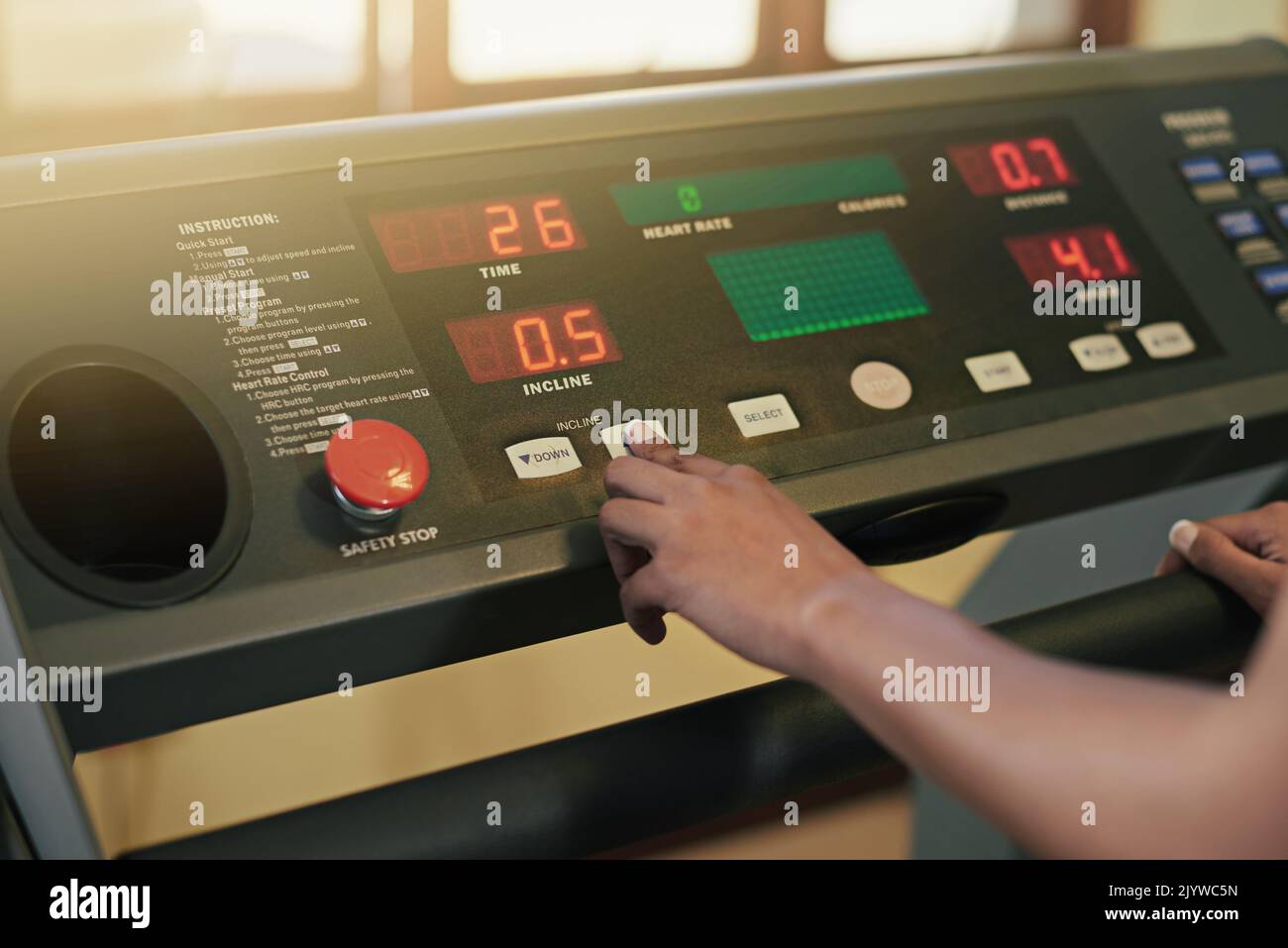 Lets speed things up a bit. a woman adjusting the controls on a ...