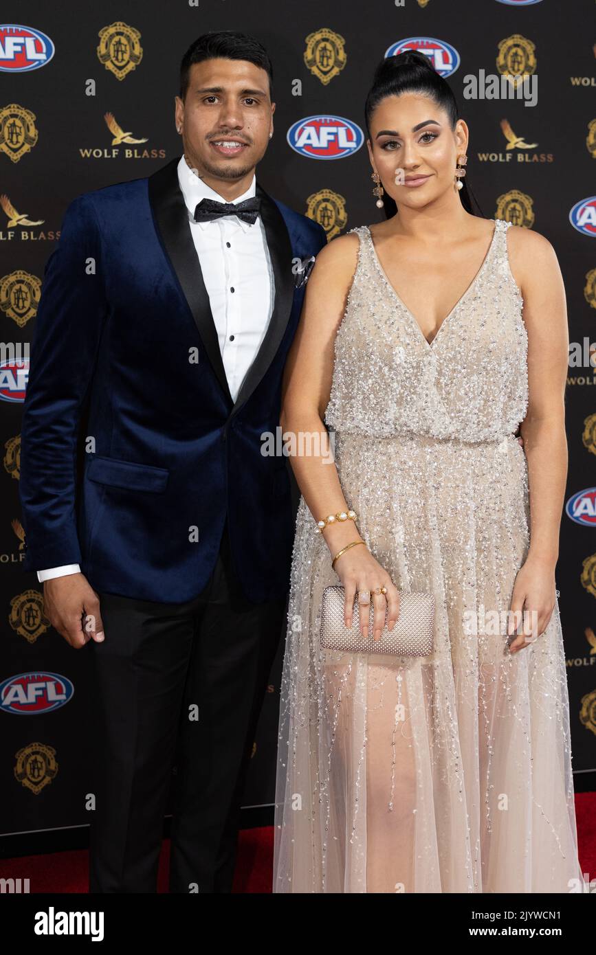 Tim Kelly of the Eagles and his partner, Caitlin Millerat, pose for a ...