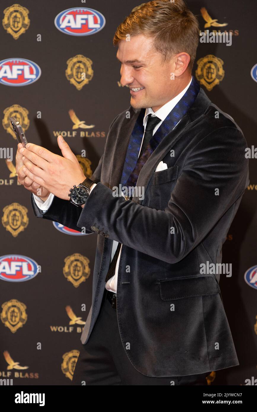 Ollie Wines of the Power talks to friends on the telephone after being ...