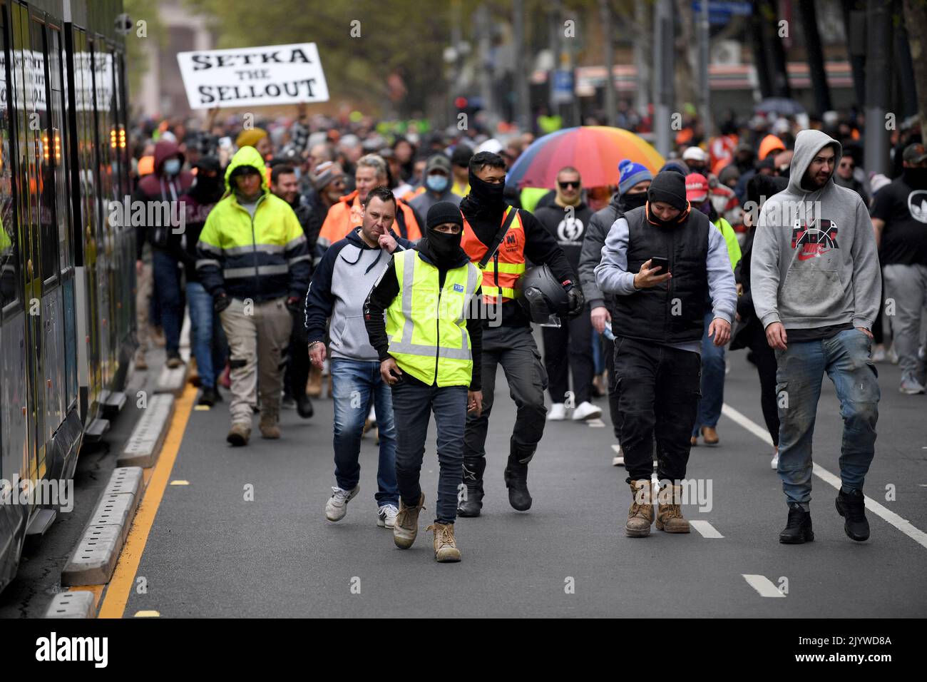 Construction workers are seen at a CFMEU protest outside Victoria’s ...