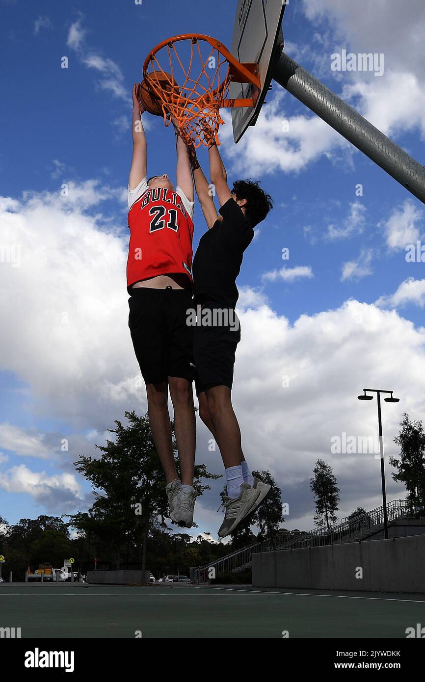 Cooper Rennie, (left) and James Baker are seen shooting hoops at a ...