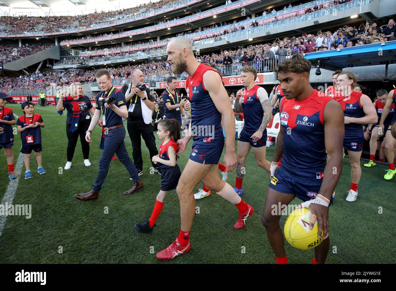 Demons players enter the field at the start of play during the AFL ...