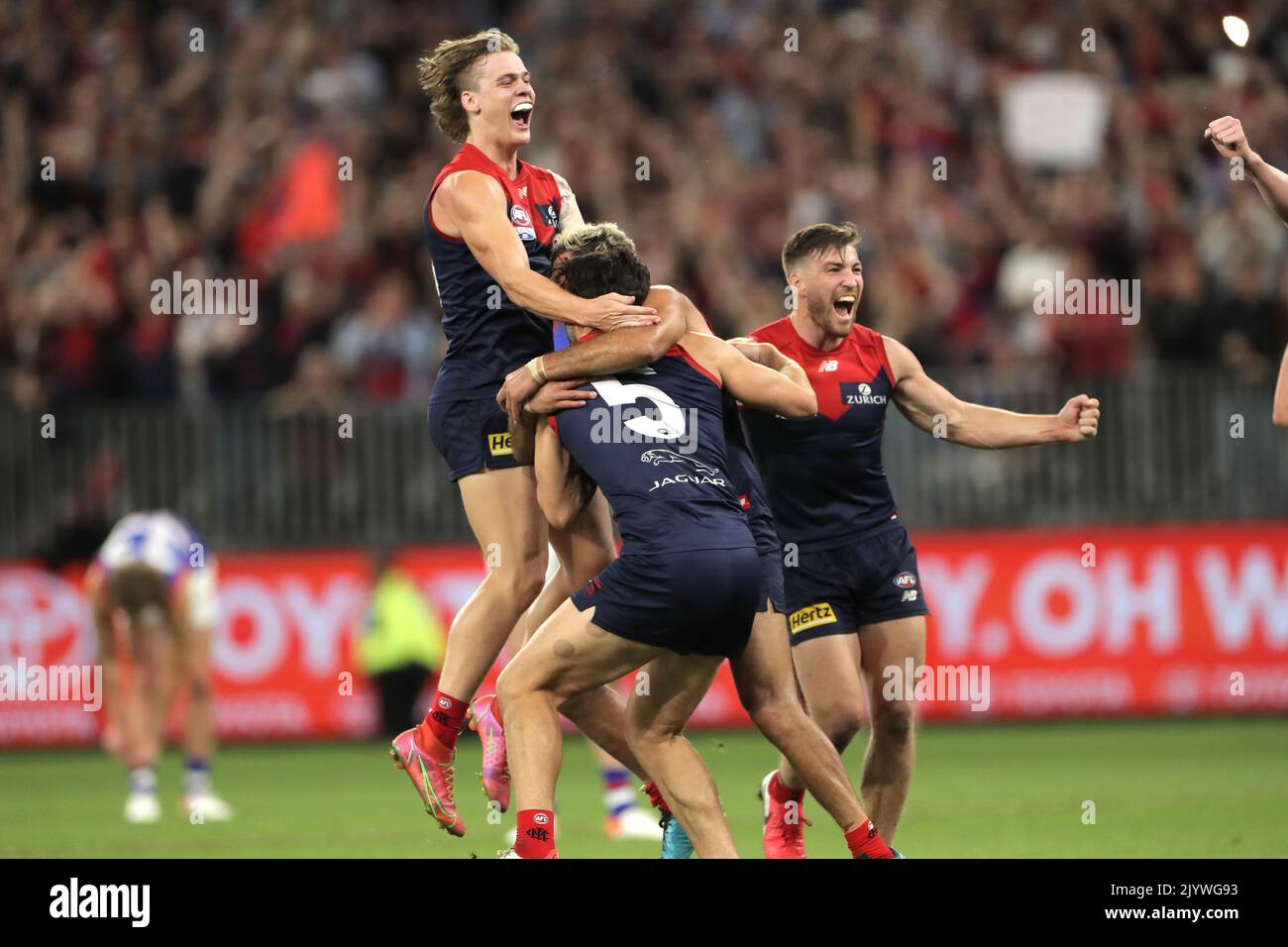 Melbourne Demons players react after winning the AFL Grand Final match ...